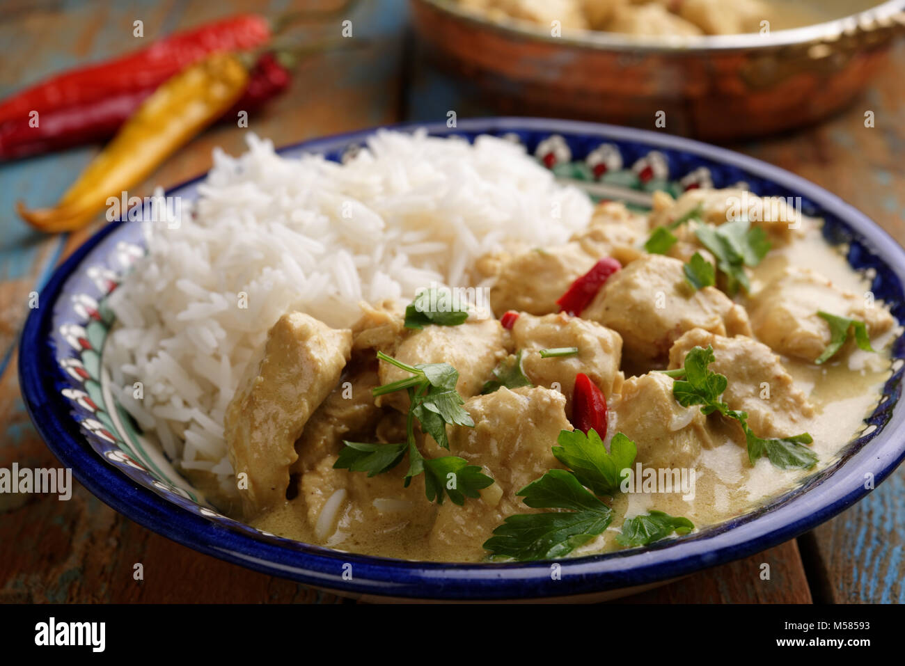 Chicken curry with rice in an ornate plate Stock Photo - Alamy