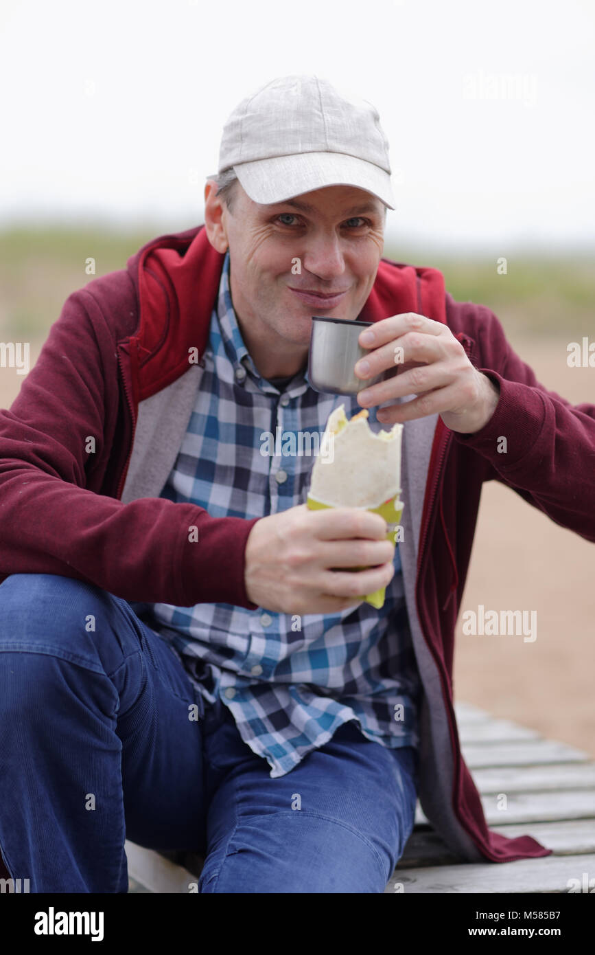 Man Eating Picnic Beach High Resolution Stock Photography and Images ...