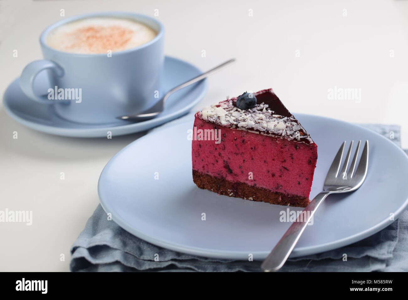 Two slices of fruit cake and a cup of coffee latte Stock Photo - Alamy
