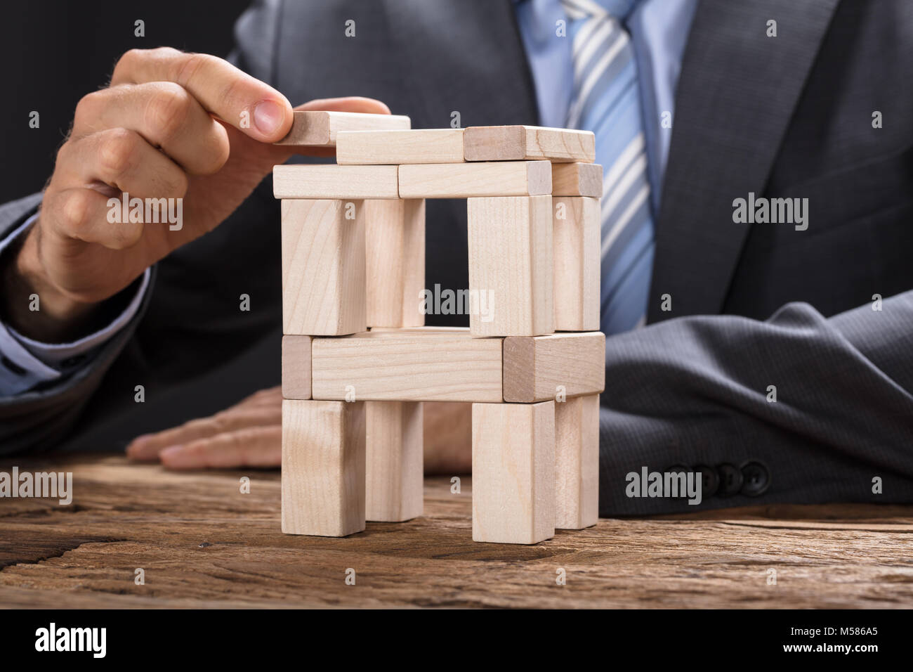 Wooden building block tower hi-res stock photography and images - Alamy