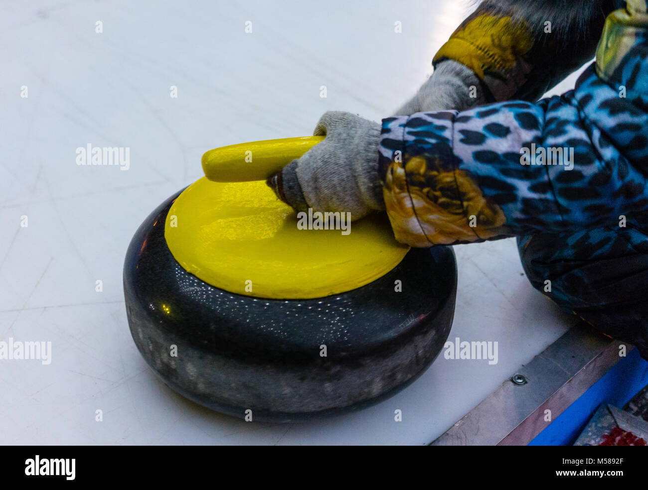 Yellow stone for game in Curling Stock Photo - Alamy