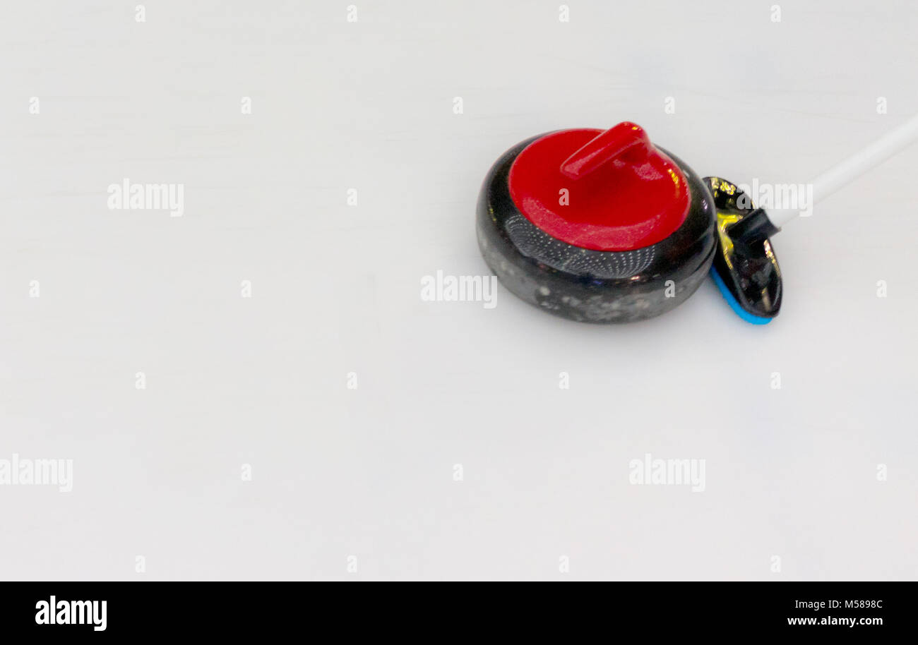 Red stone for game in Curling Stock Photo - Alamy