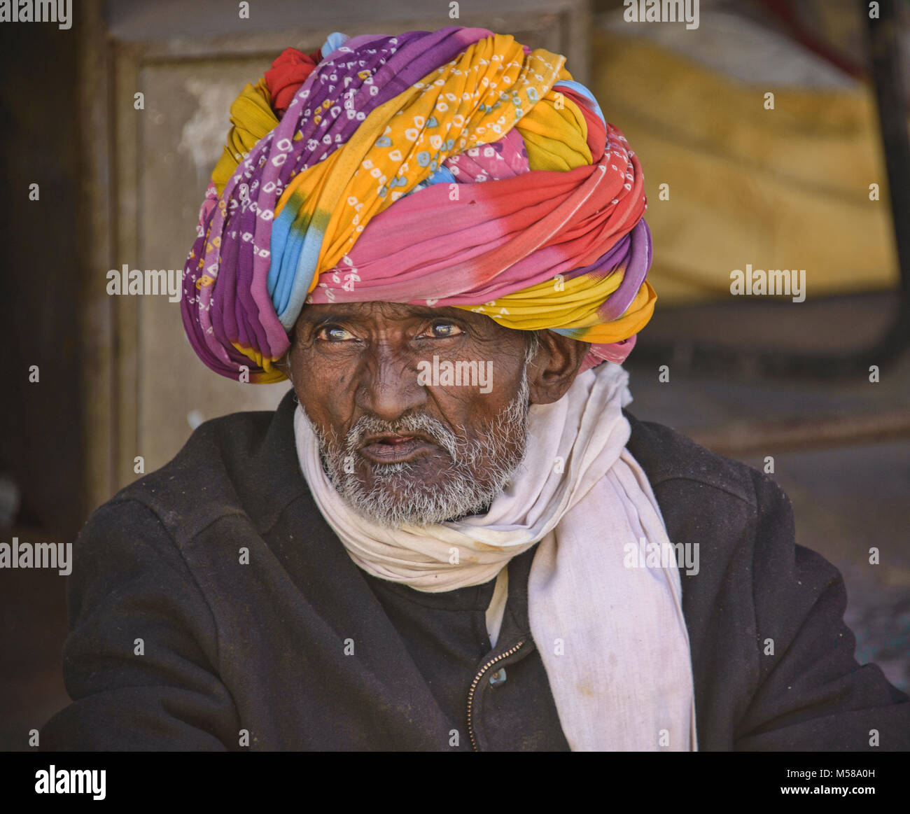 Wearing colourful head covering turban hi-res stock photography and ...