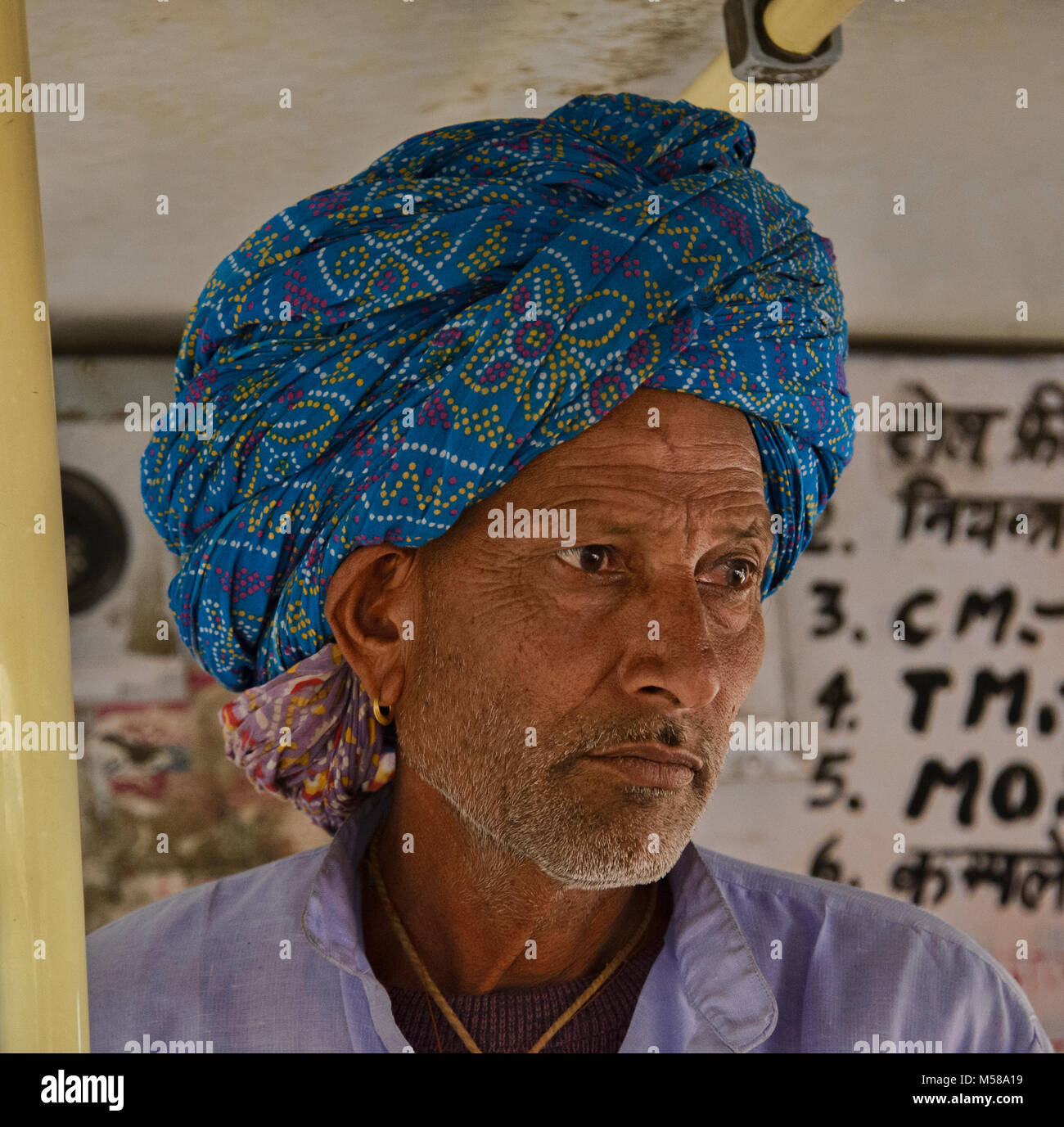 Wearing colourful head covering turban hi-res stock photography and ...