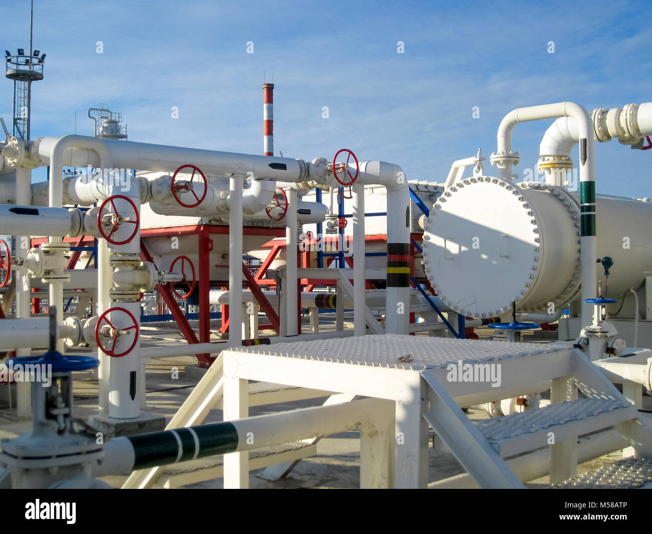 Heat exchangers in a refinery. The equipment for oil refining. Heated ...