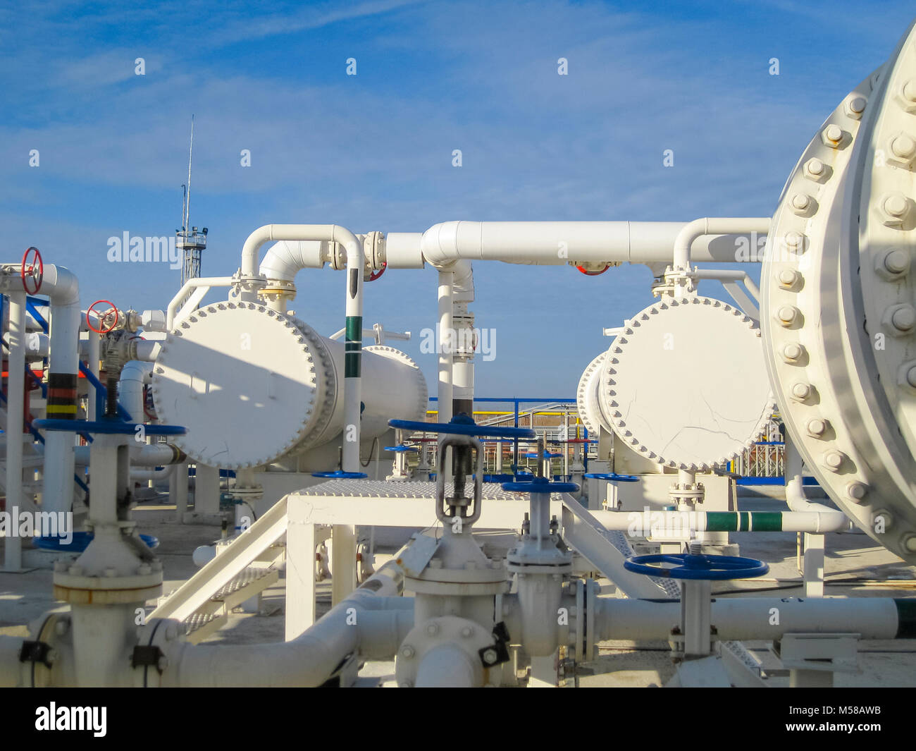 Heat exchangers in a refinery. The equipment for oil refining. Heated ...