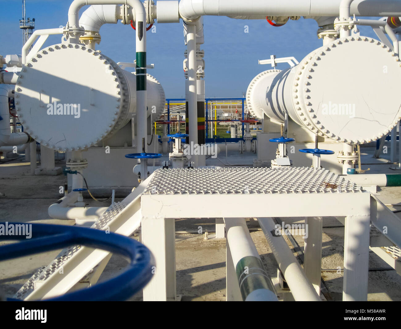 Heat exchangers in a refinery. The equipment for oil refining. Heated ...