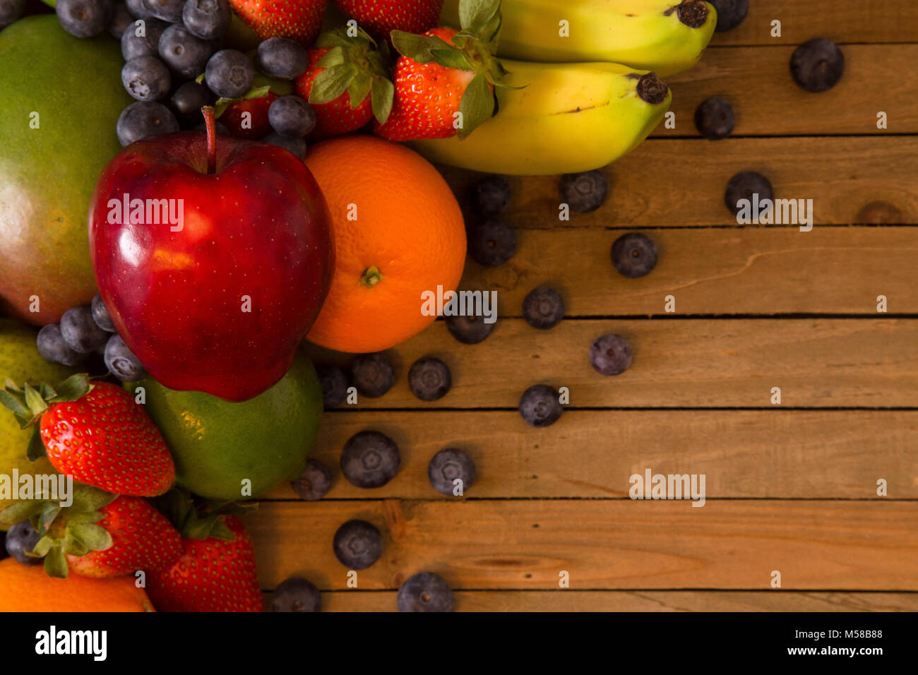 Array of Fruits on a Wooden Table Stock Photo - Alamy