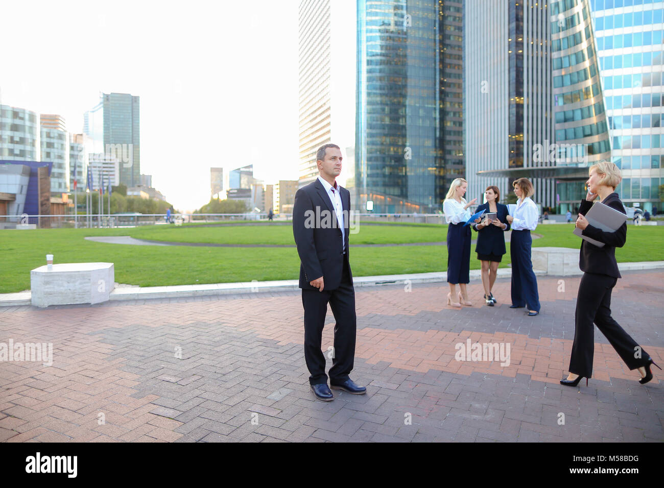 Businessman looking watch partners in hi-res stock photography and ...