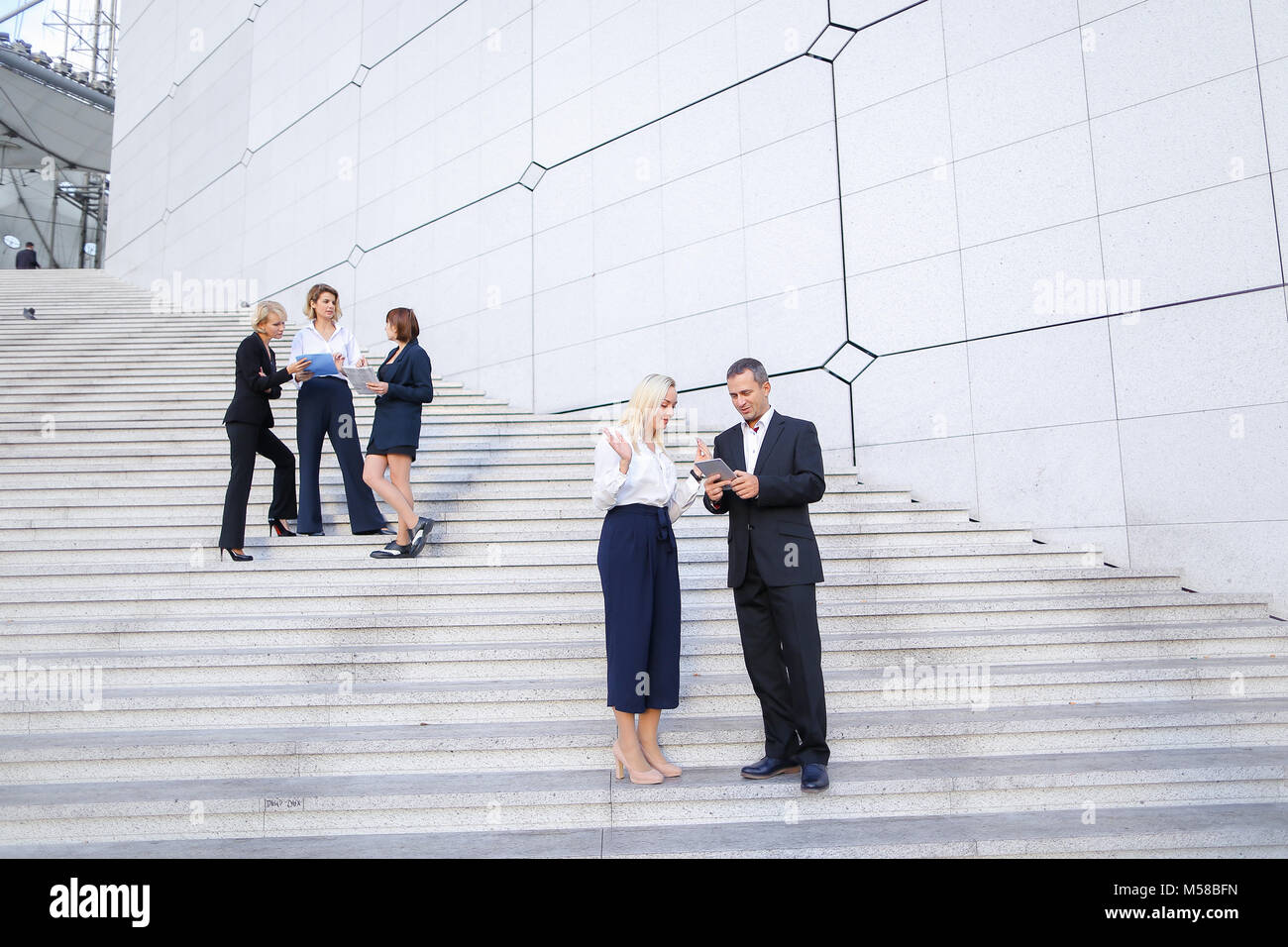 Foreign business colleagues in official journey talking and keep Stock ...