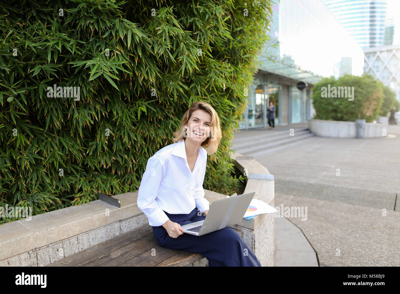Statistician working outside laptop color hi-res stock photography and ...