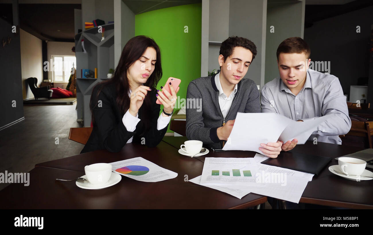 Active and funny managers, woman and men talk about work and stu Stock ...