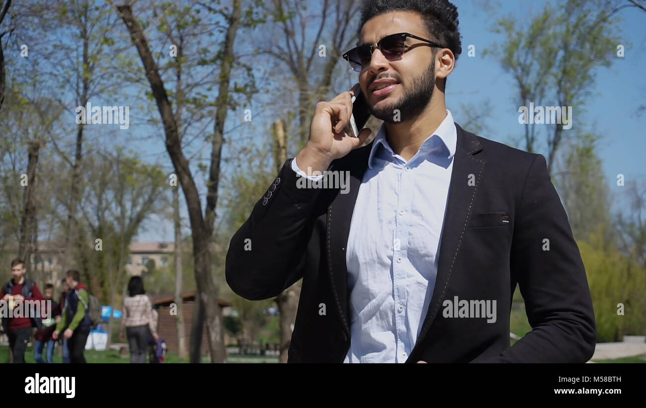 Cheerful arab man talking online hi-res stock photography and images ...