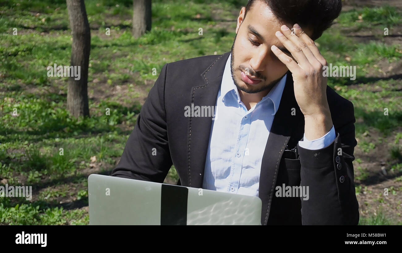 Upset young businessman waiting sitting hi-res stock photography and ...