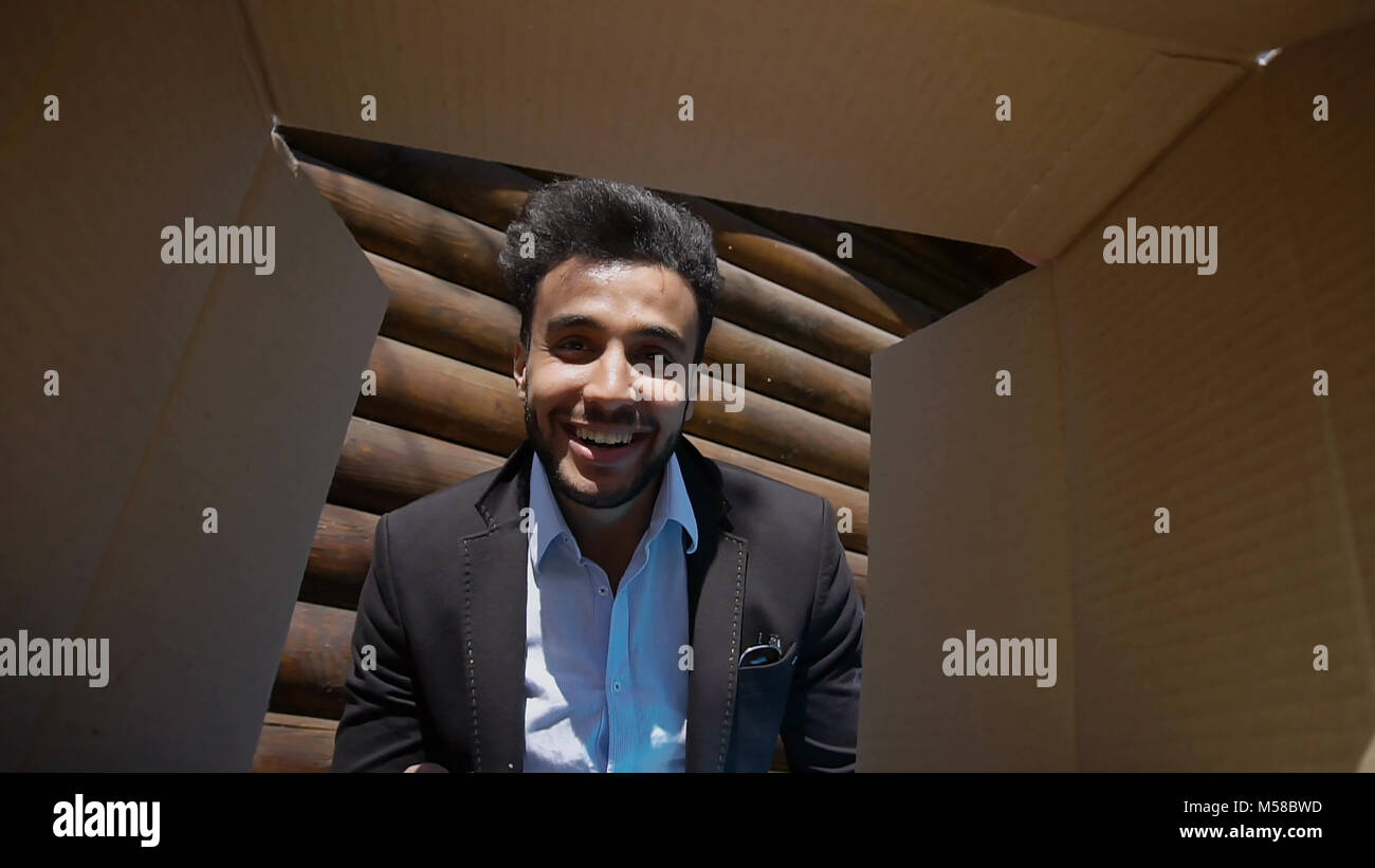 Boy signs for package and smiling Stock Photo - Alamy