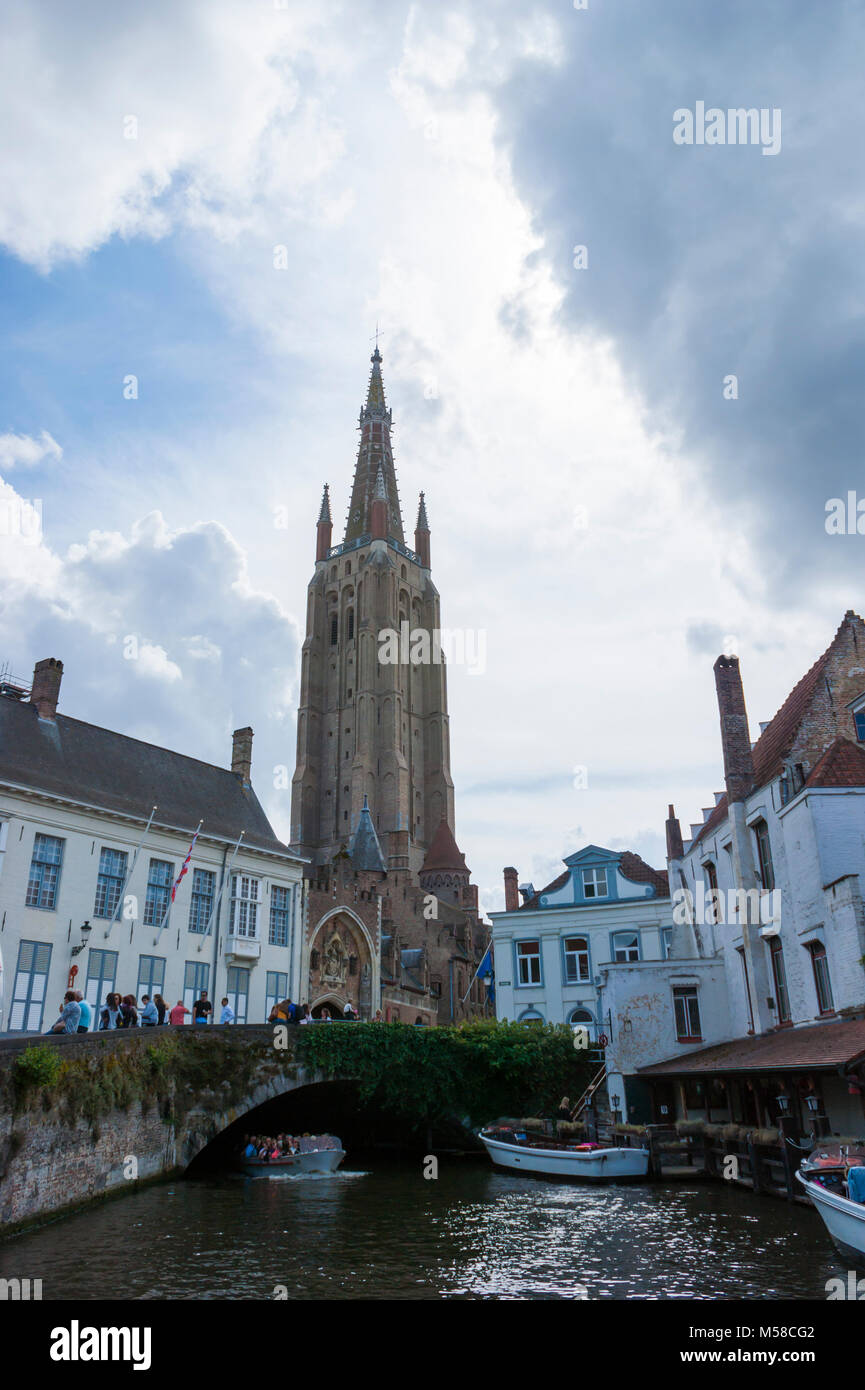 View of the Dijver canal with the spire of the Church of Our Lady ...