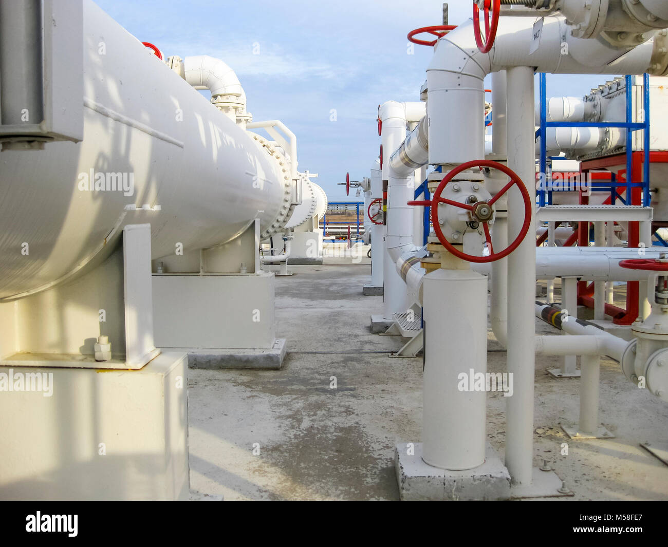 Heat exchangers in a refinery. The equipment for oil refining. Heated ...