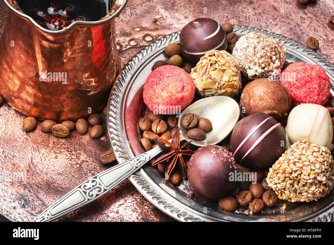 Delicious chocolate candies and fragrant black coffee Stock Photo - Alamy