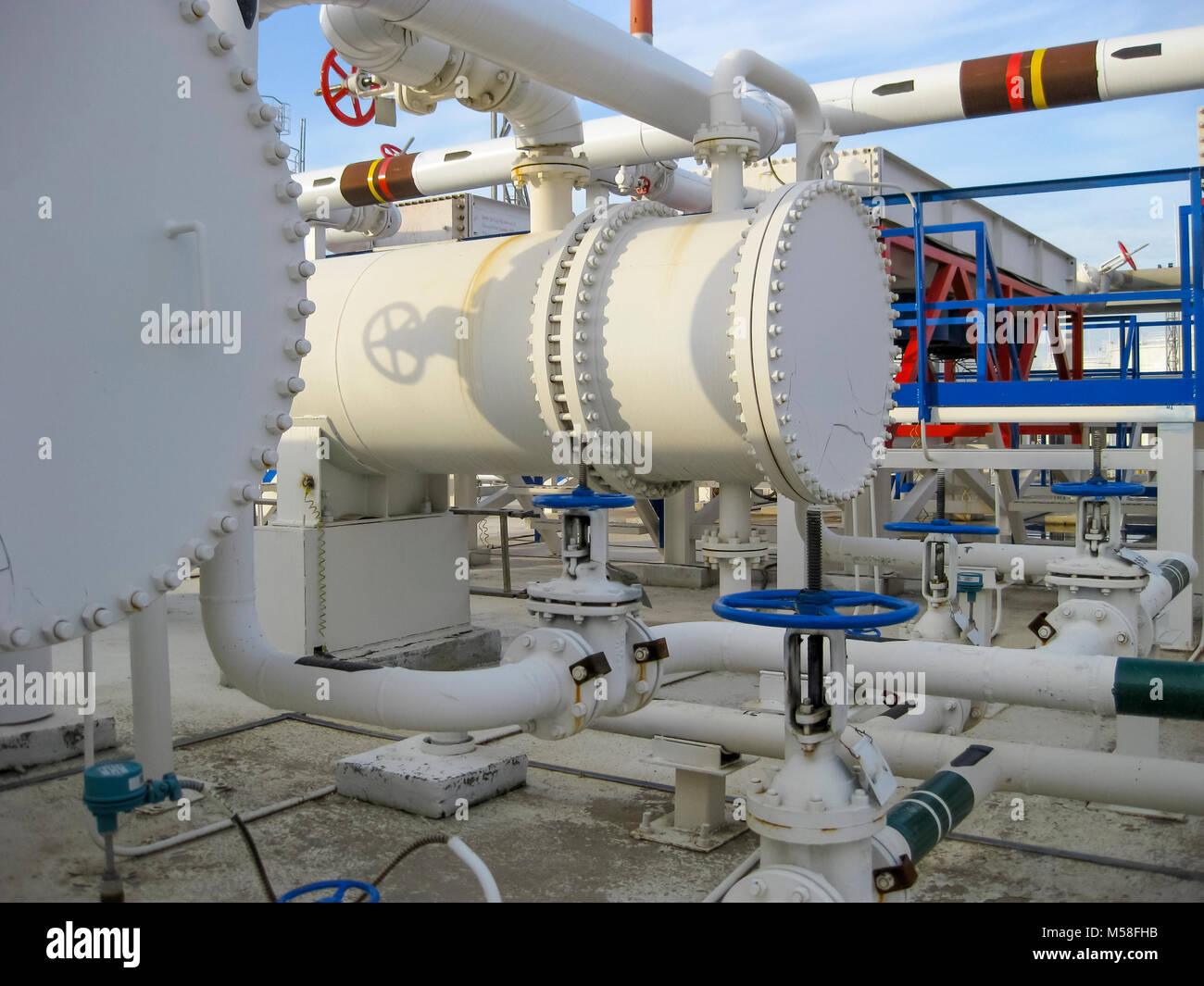 Heat exchangers in a refinery. The equipment for oil refining. Heated ...
