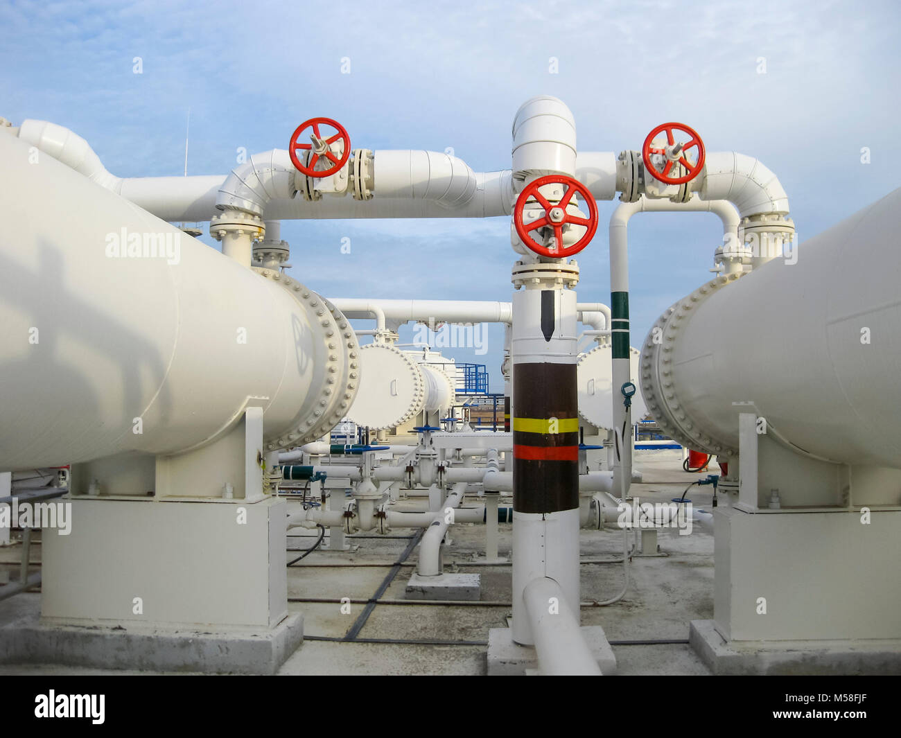 Heat exchangers in a refinery. The equipment for oil refining. Heated ...