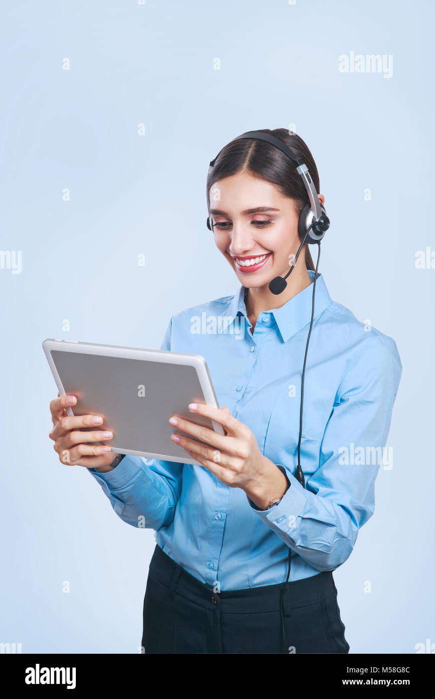 Female customer support operator with tablet. Call center operator ...