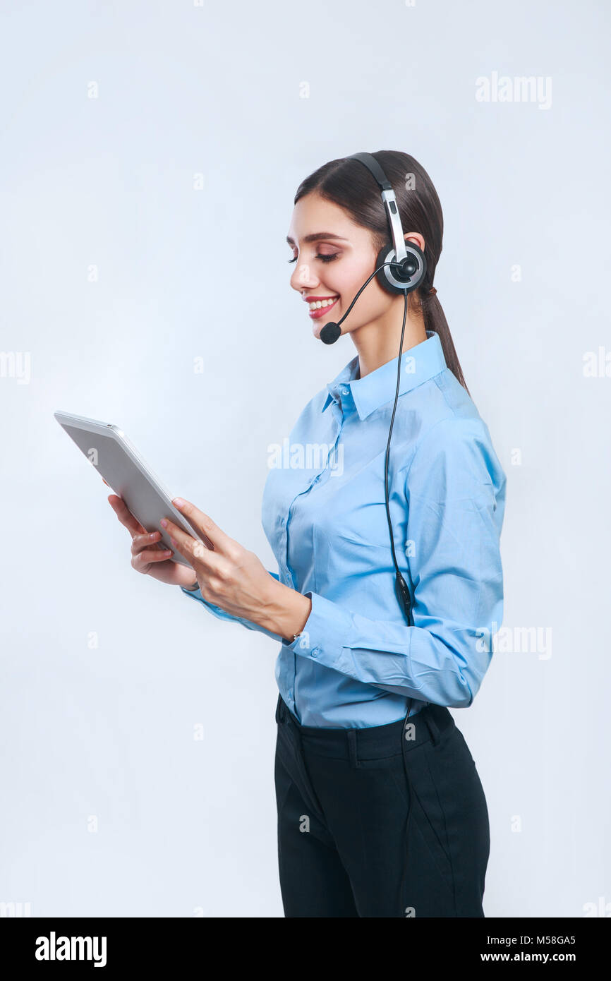 Female customer support operator with tablet. Call center operator ...