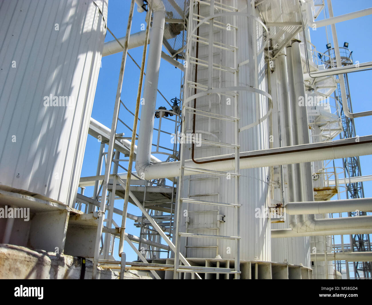 Rectification columns of the oil refinery. Refinery equipment. Oil ...