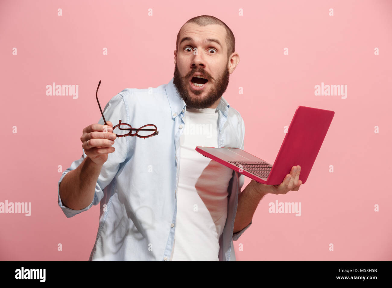Businessman hugging laptop Stock Photo - Alamy