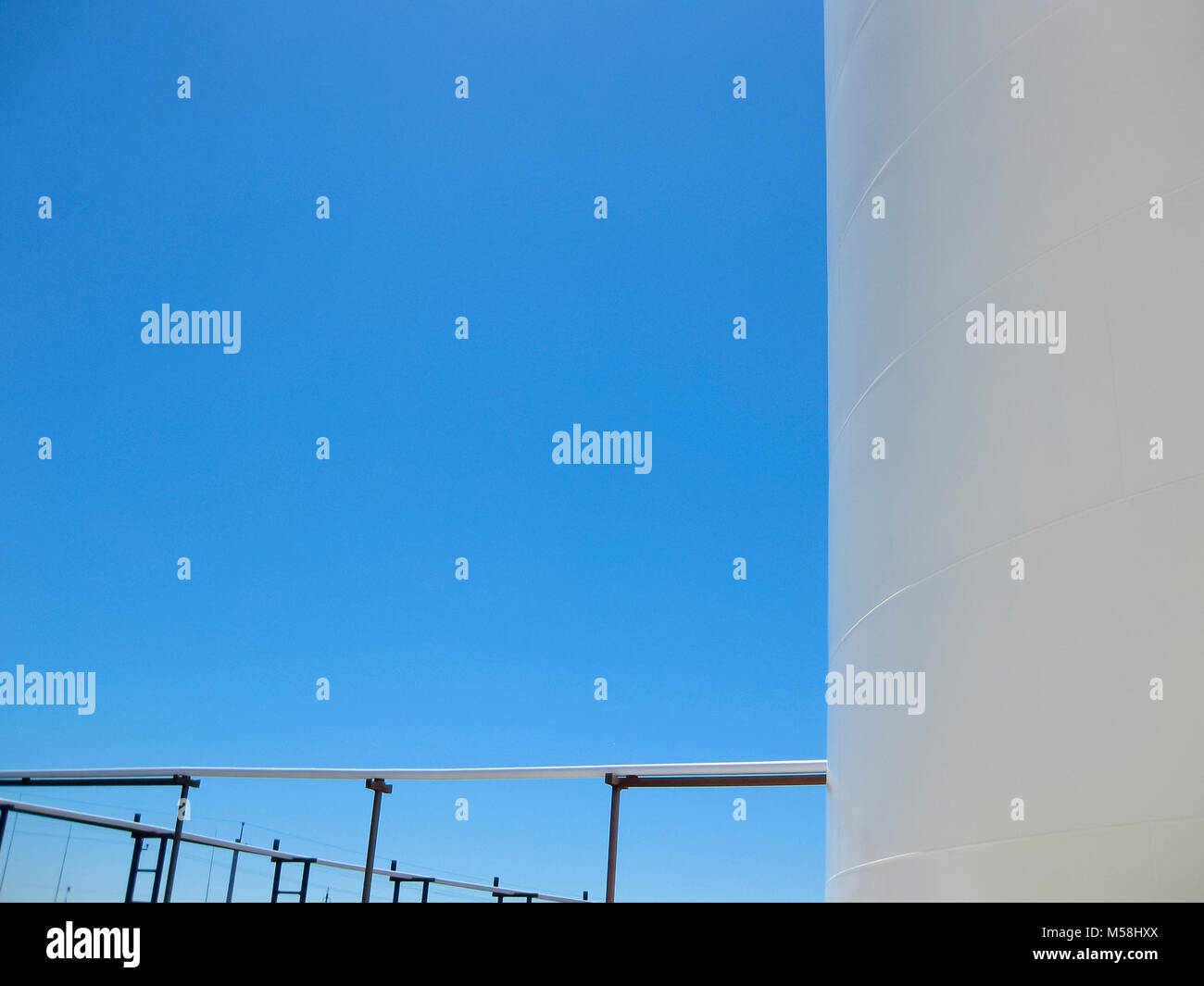 The tank with water and a ladder. Oil refinery. Equipment for primary ...