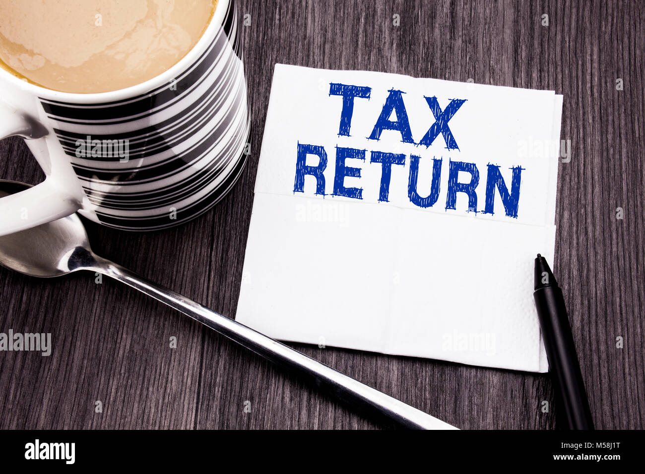 Handwritten text showing Tax Return. Business concept for Taxation ...