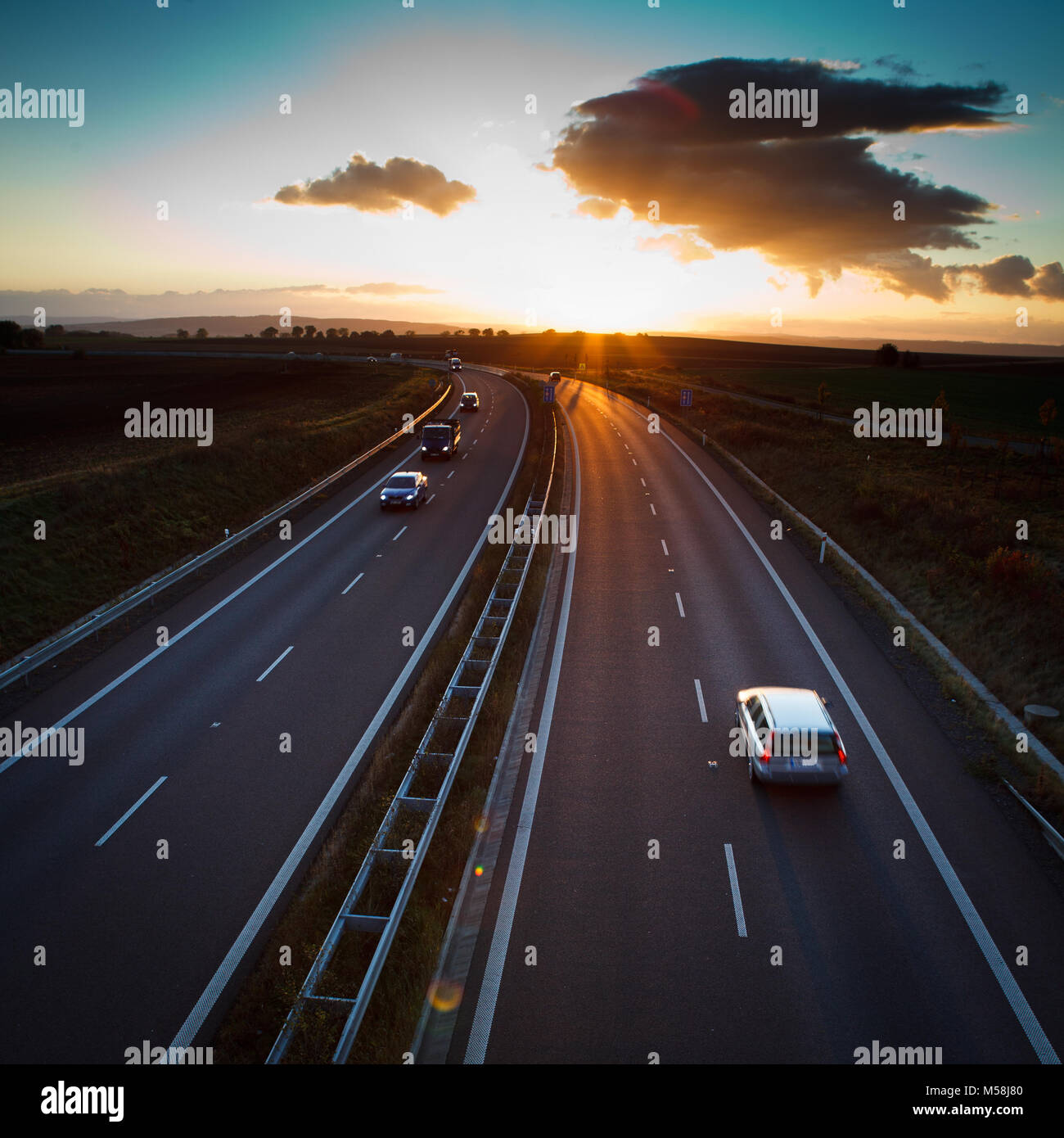 highway traffic - motion blurred truck on a highway/motorway/speedway ...