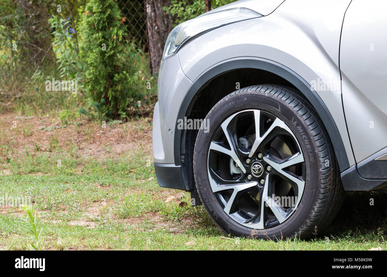 Concept shot of rims and tires of modern crossover car - Toyota CH-R ...