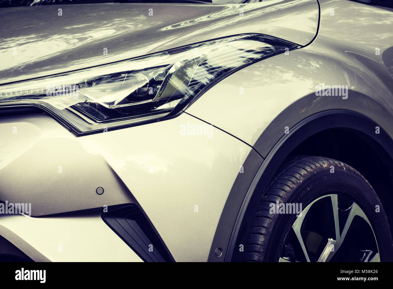 Concept shot of headlamp and part of modern crossover car - Toyota CH-R ...