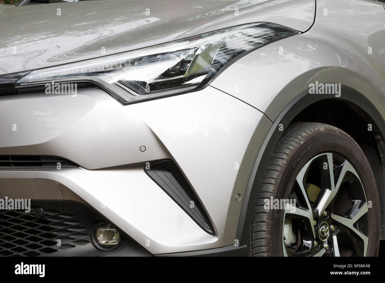 Concept shot of headlamp and part of modern crossover car - Toyota CH-R ...