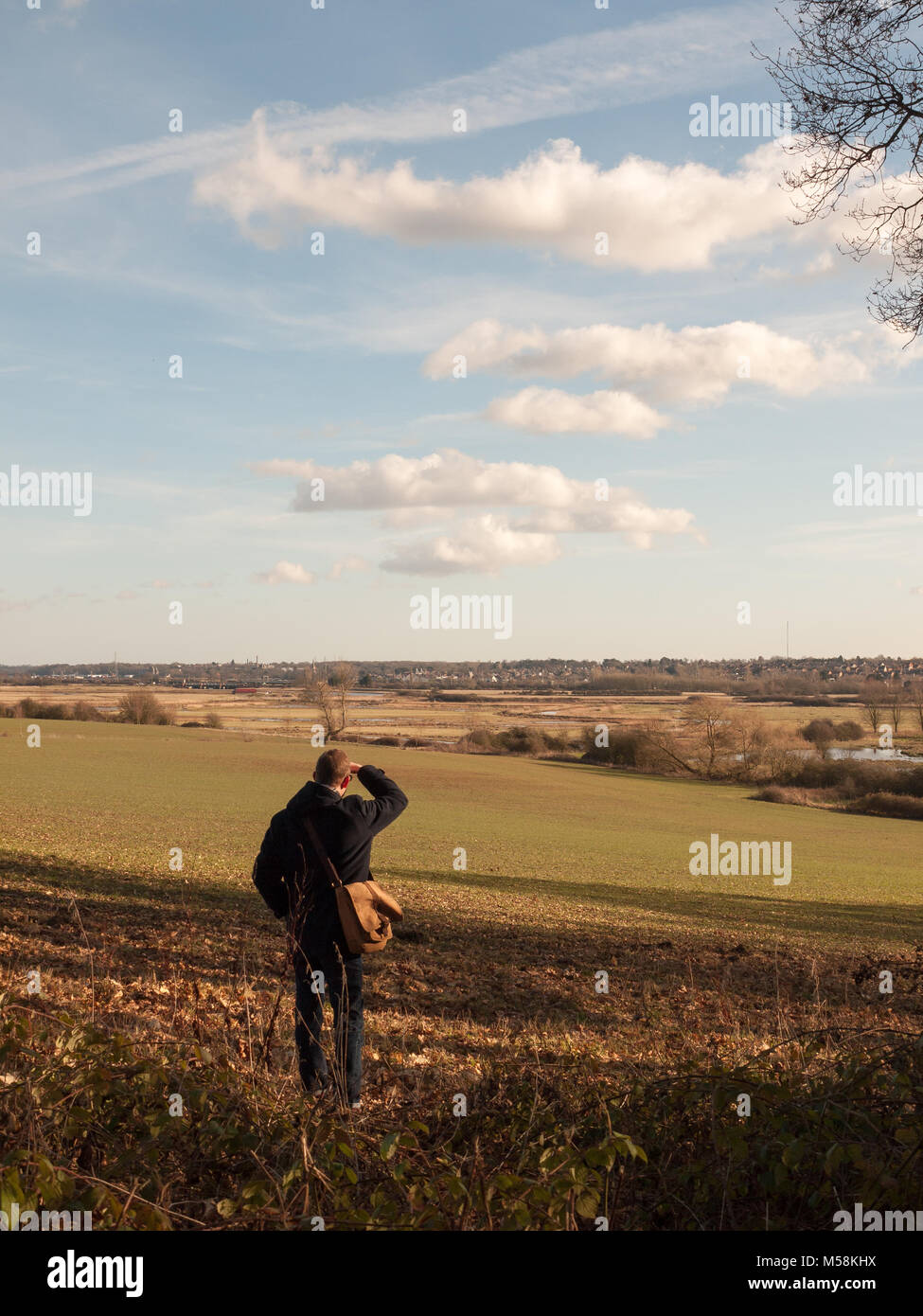 view of person looking out of large expanse space field agriculture ...