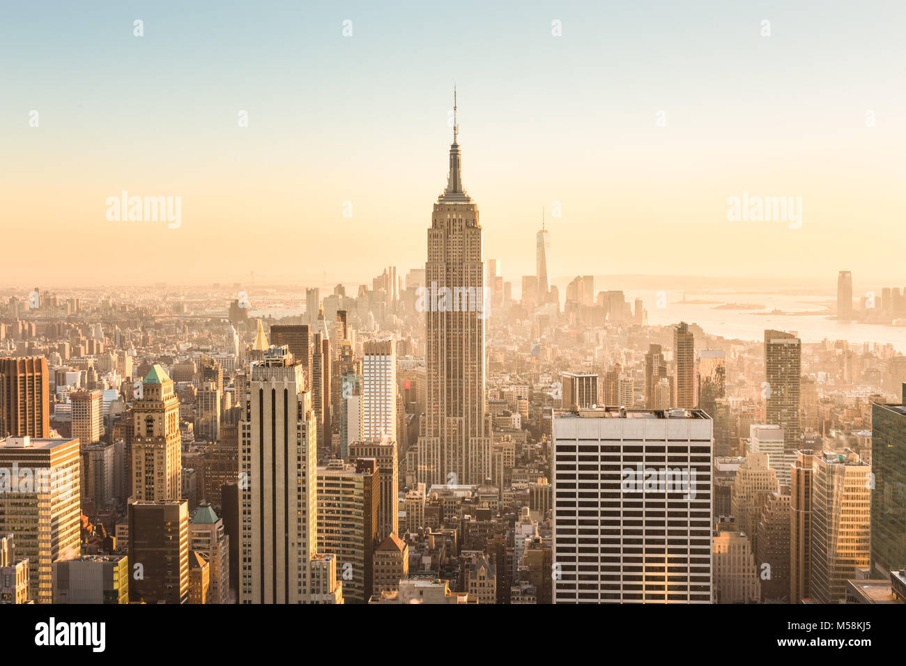 New York City skyline with urban skyscrapers at sunset, USA Stock Photo ...