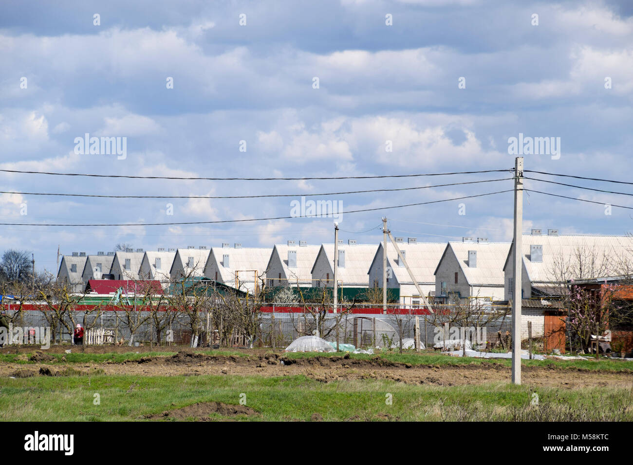 Street with the same houses. Similar houses Stock Photo - Alamy