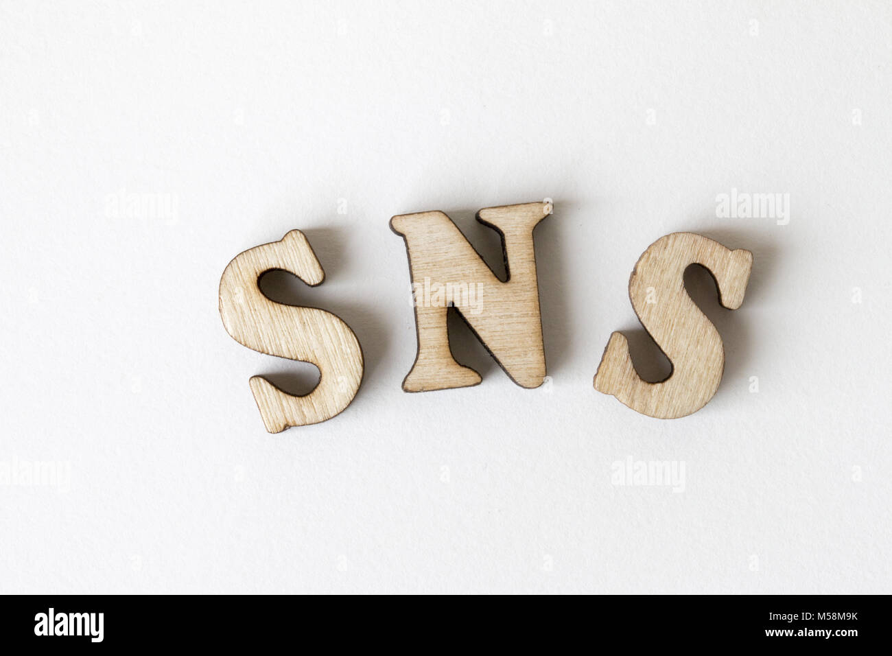 SNS, Wood letters SNS on White background Stock Photo - Alamy