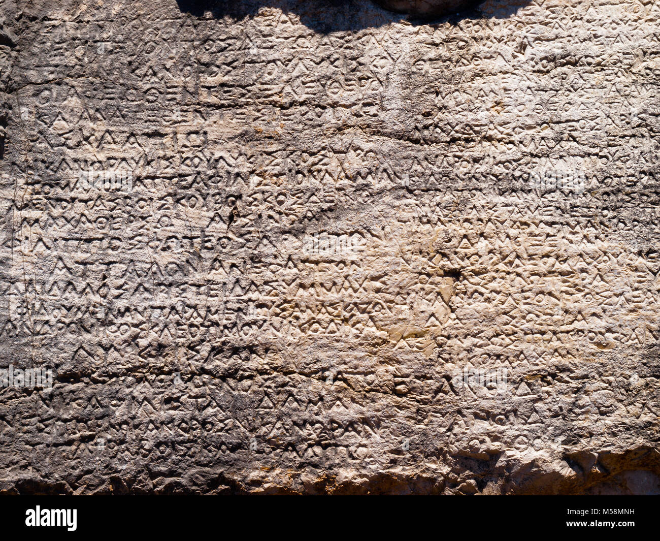 Stone plaque with carved ancient scriptures Stock Photo - Alamy