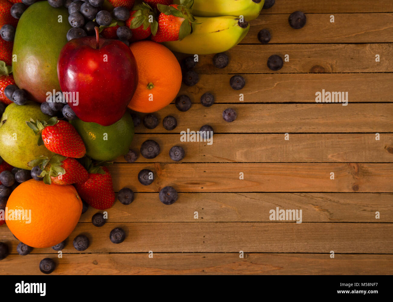 Array of Fruits on a Wooden Table Stock Photo - Alamy