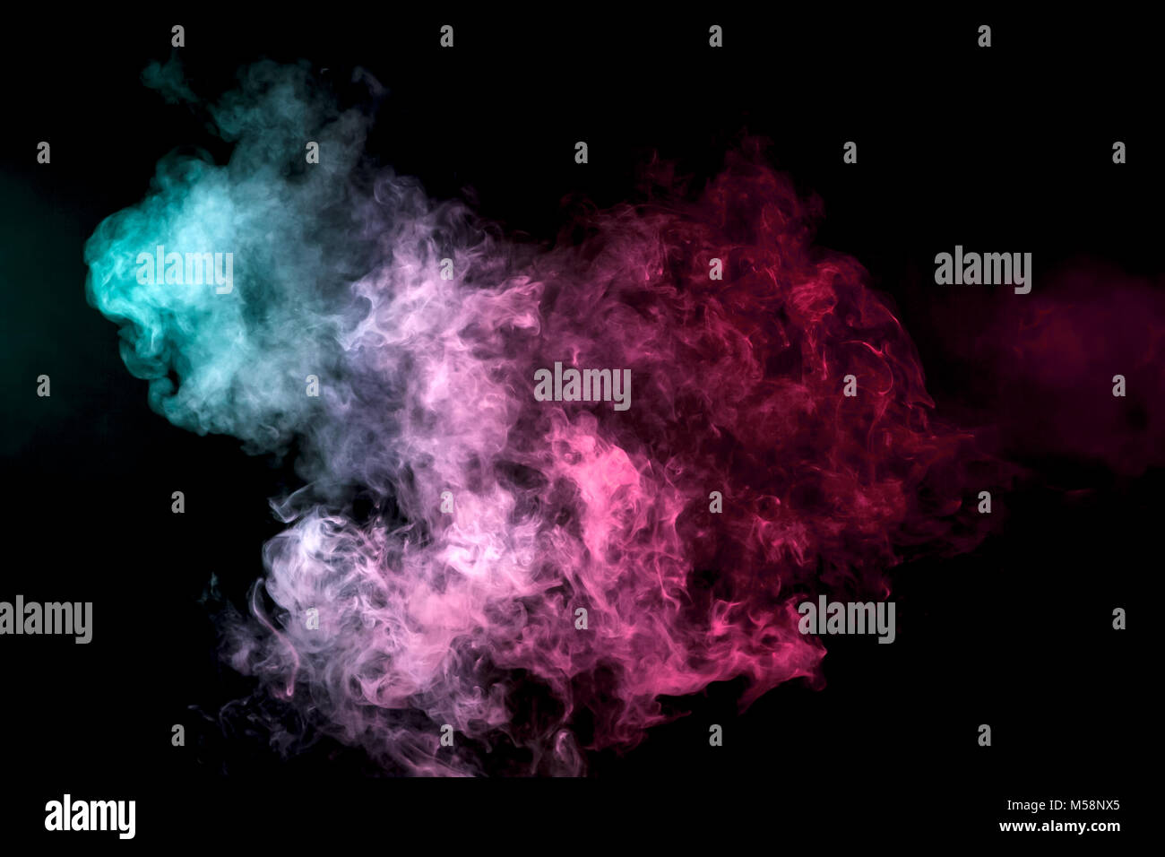 Cloud of smoke of green, pink isolated background. Background from the ...