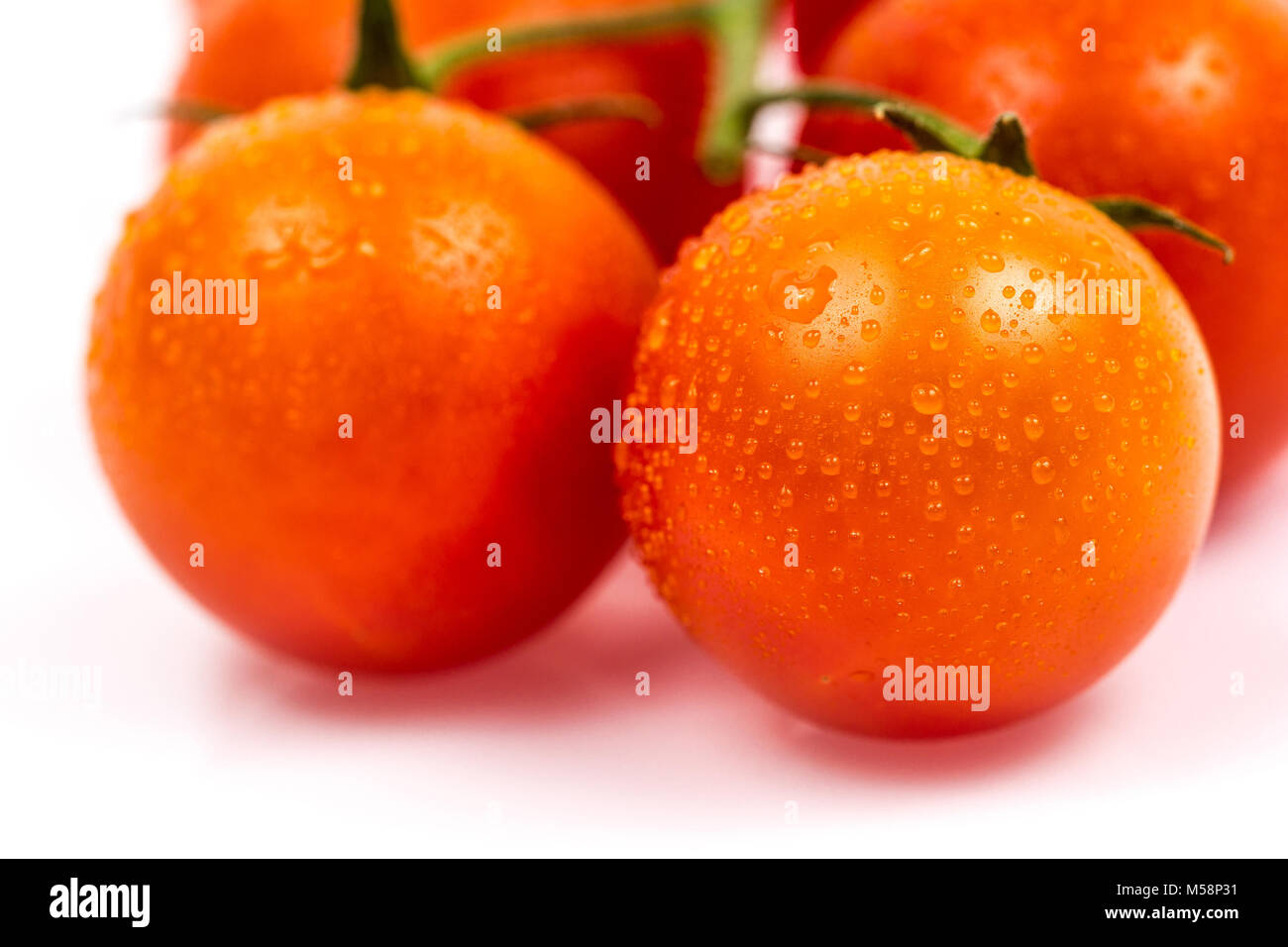 Tomato with water drops isolated on white background Stock Photo - Alamy