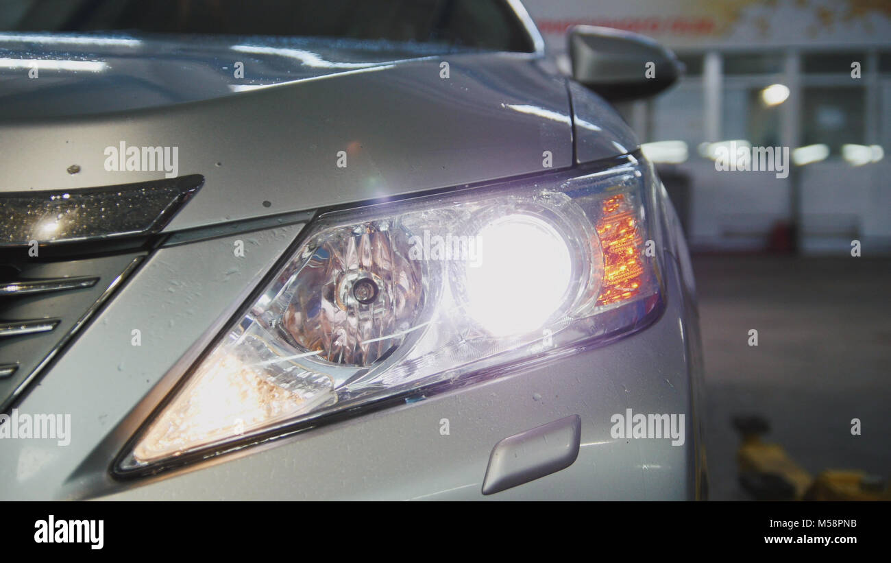 Auto service - checking headlights of car Stock Photo - Alamy