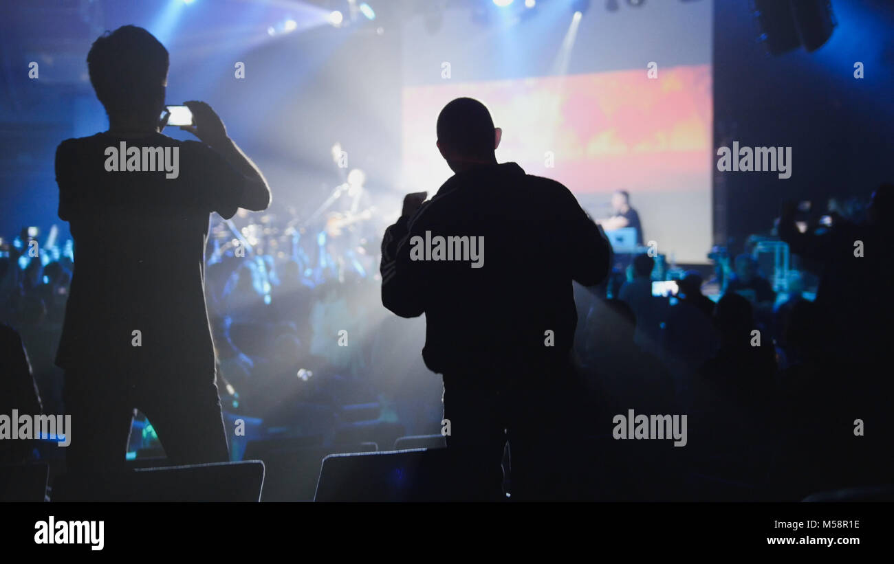 Shadows of people making a video of the concert on a mobile phone Stock ...