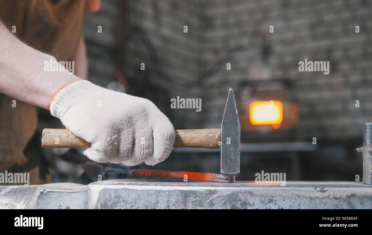 Work in forge - Hammer on the anvil, metal work, close up Stock Photo ...
