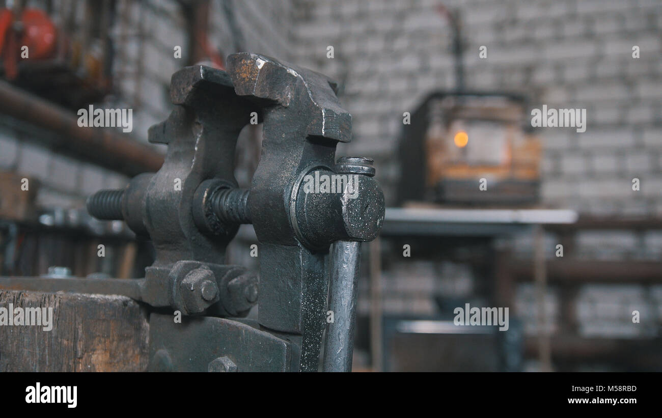 Inside forge workshop - steel vise, close up Stock Photo - Alamy