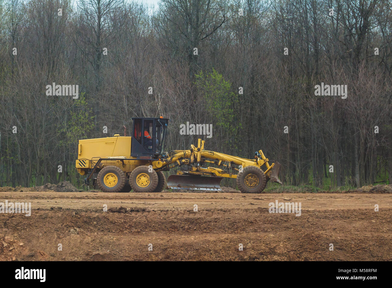 Road scraper - grader - highway construction - asphalt loader Stock ...