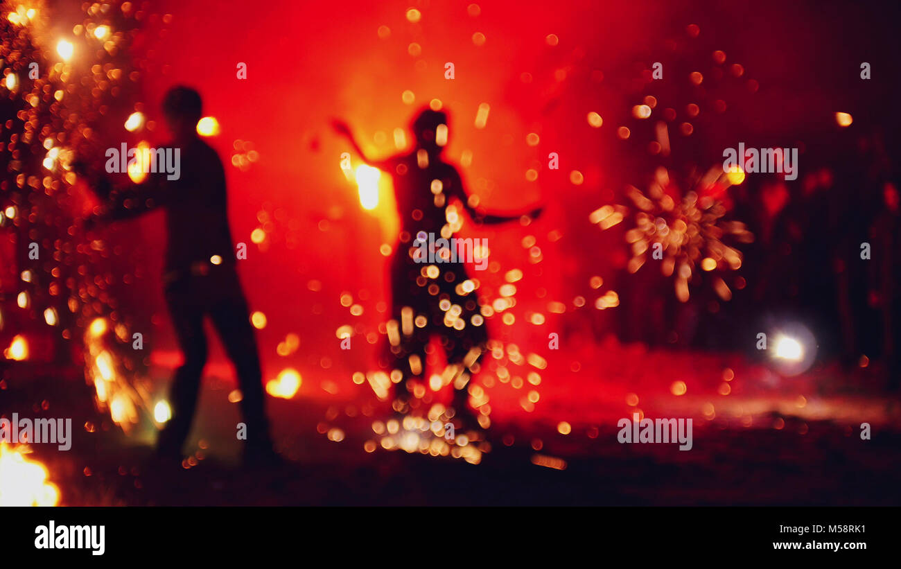 Night fire-show -dance with sparkles on the beach Stock Photo - Alamy