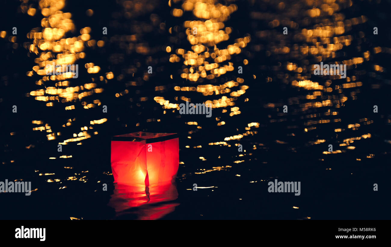 Floating lighting water Lanterns on river at night Stock Photo - Alamy