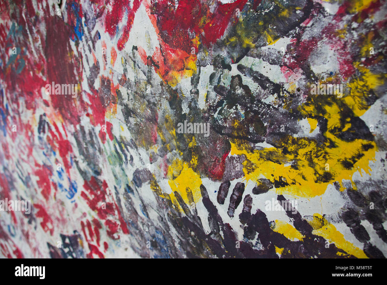 colourful painted handprints on white wall Stock Photo - Alamy